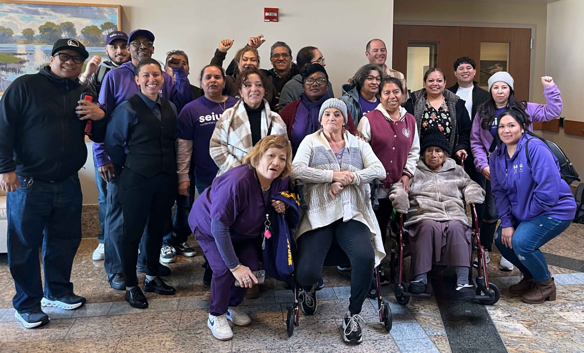San Joaquin home care workers, recipients and allies smile and raise ...